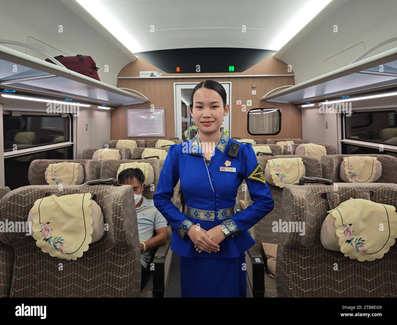 Vientiane. 4th Dec, 2023. Chief conductor Bounmee works on a bullet train on the China-Laos ...
