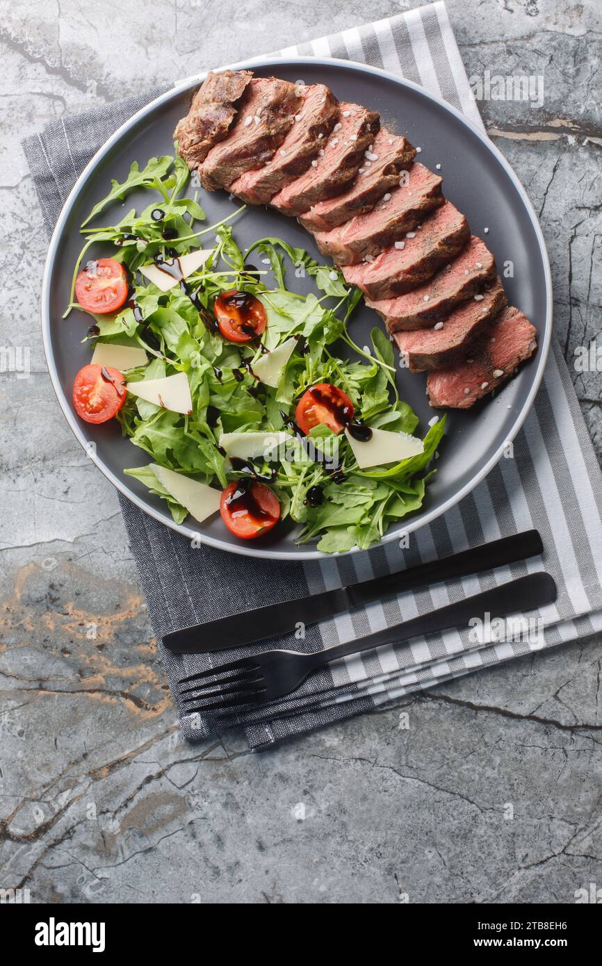Tagliata di manzo Italian style beef steak served with arugula, cherry ...