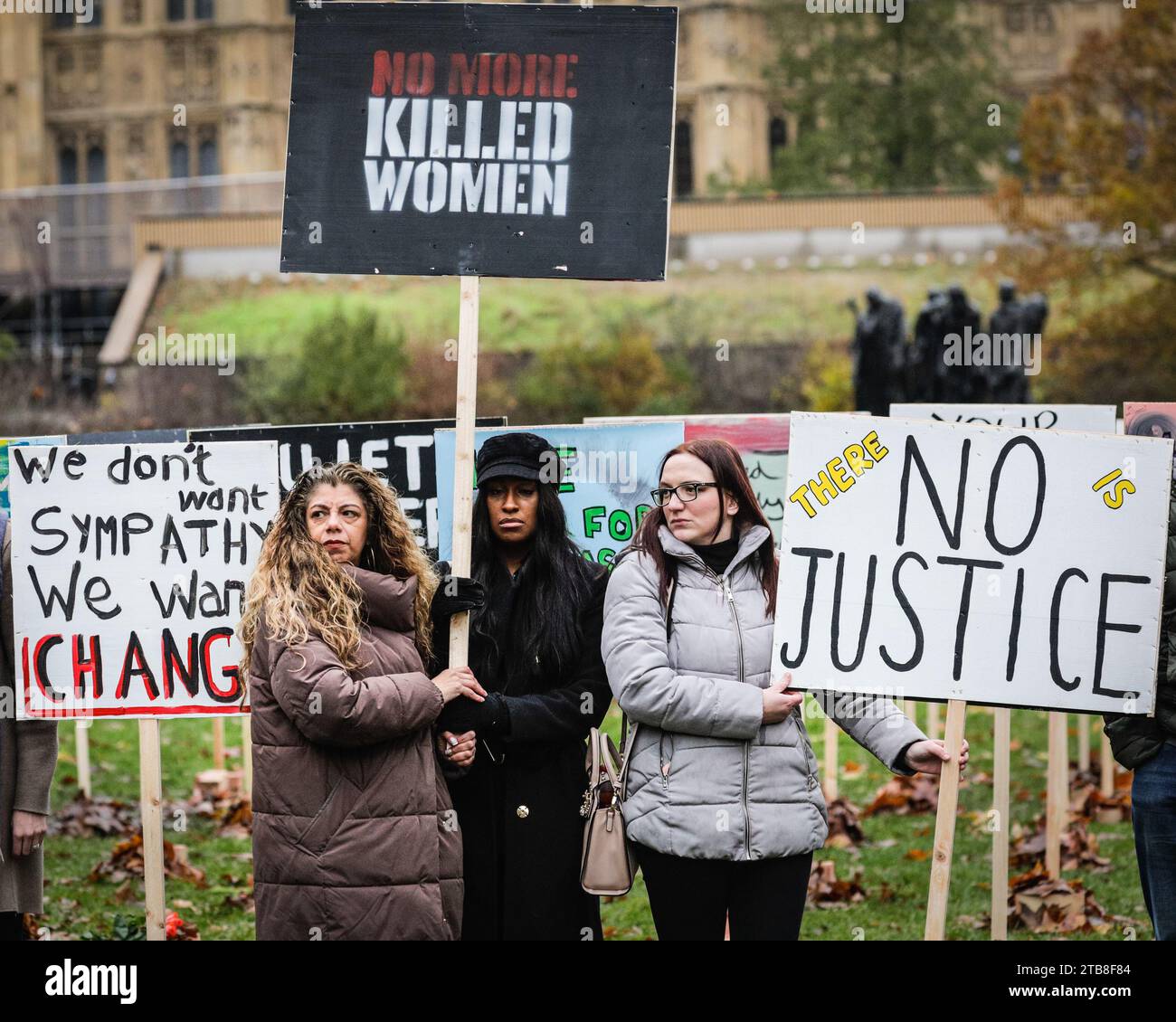 London, UK 05th Dec 2023. Affected and bereaved families stand with an ...