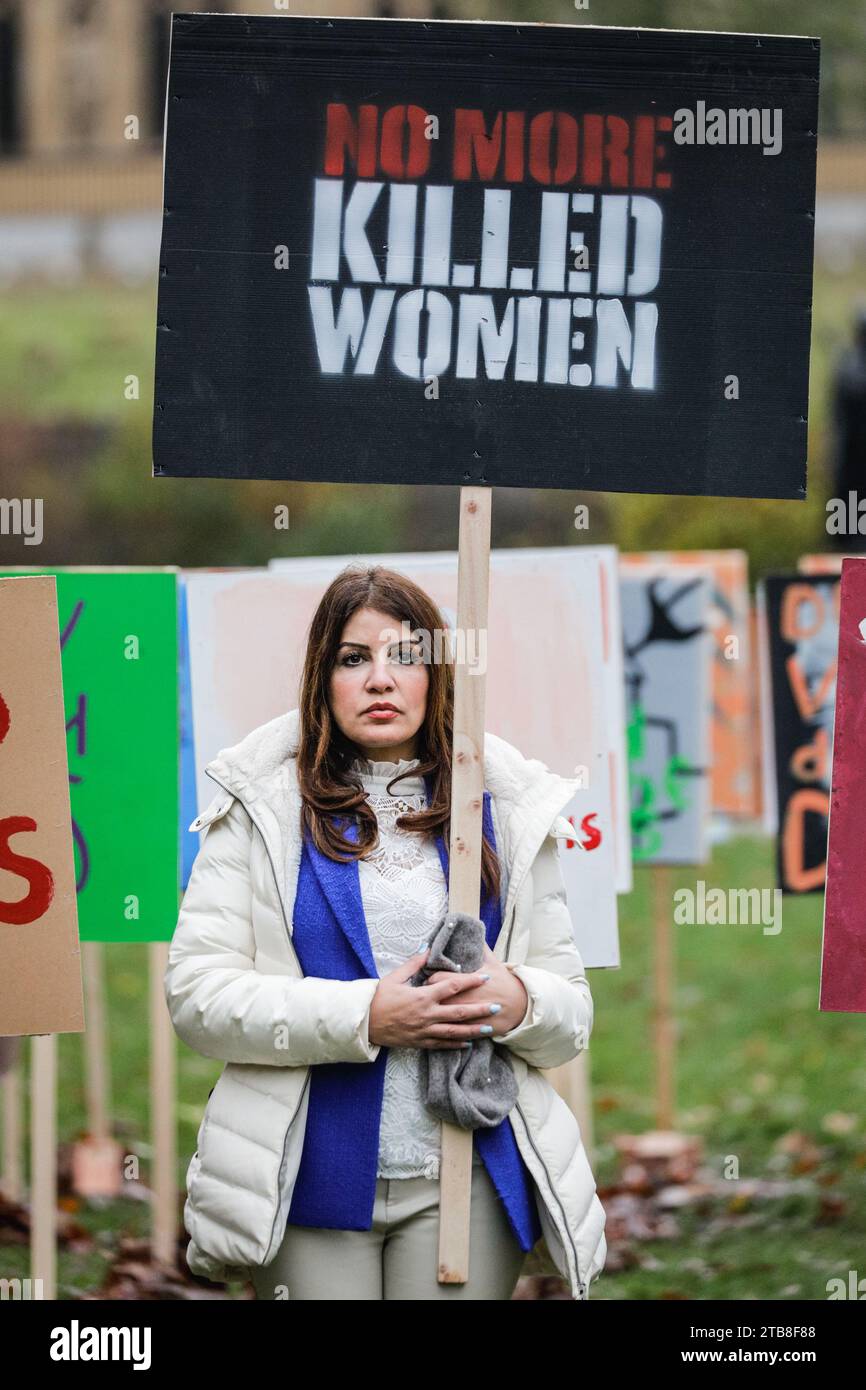 London, UK 05th Dec 2023. Affected and bereaved families stand with an ...