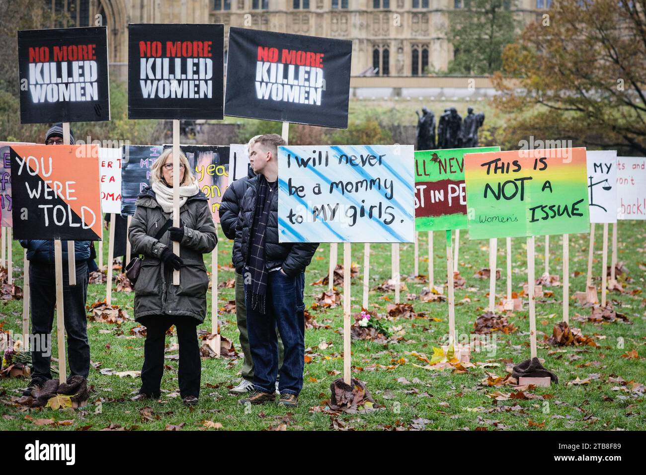 London, UK 05th Dec 2023. Affected and bereaved families stand with an ...