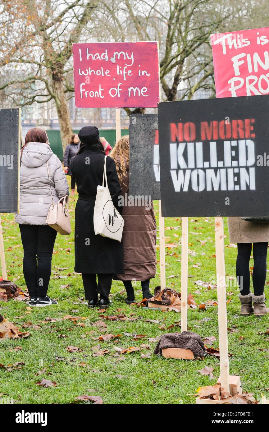 London, UK 05th Dec 2023. Affected and bereaved families stand with an ...