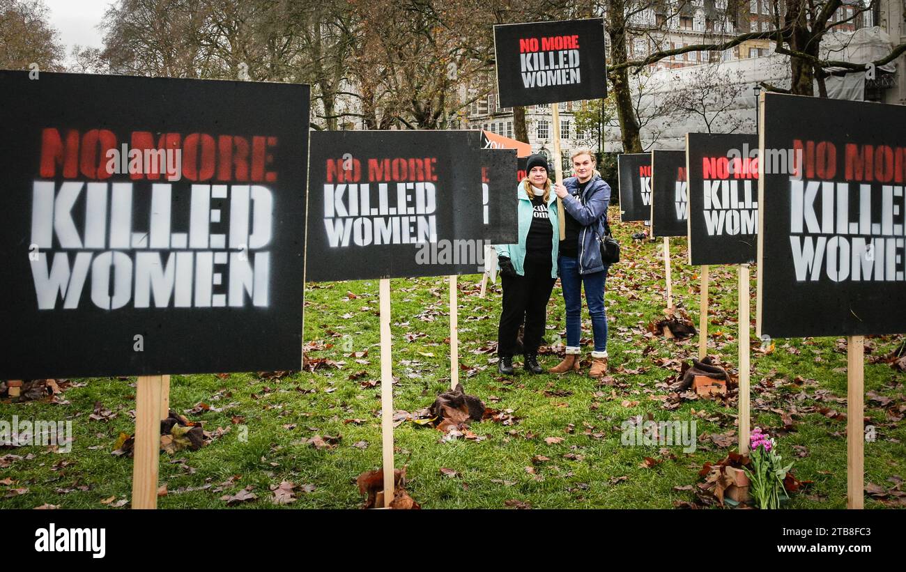 London, UK 05th Dec 2023. Affected and bereaved families stand with an ...