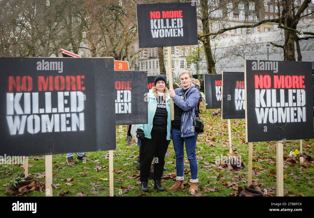 London, UK 05th Dec 2023. Affected and bereaved families stand with an ...