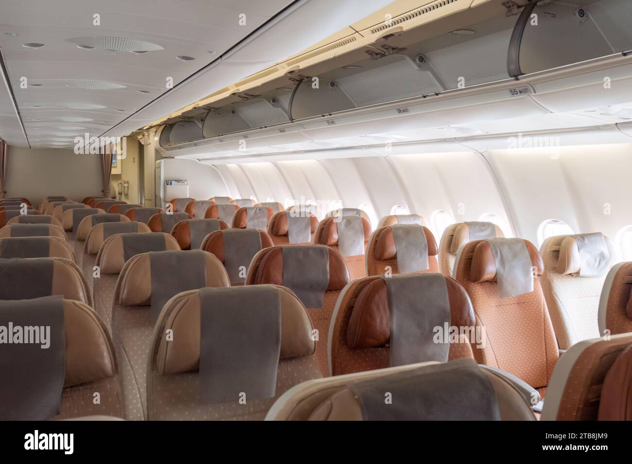 Row of commercial aircraft passenger seat and aisle cabin in airplane ...