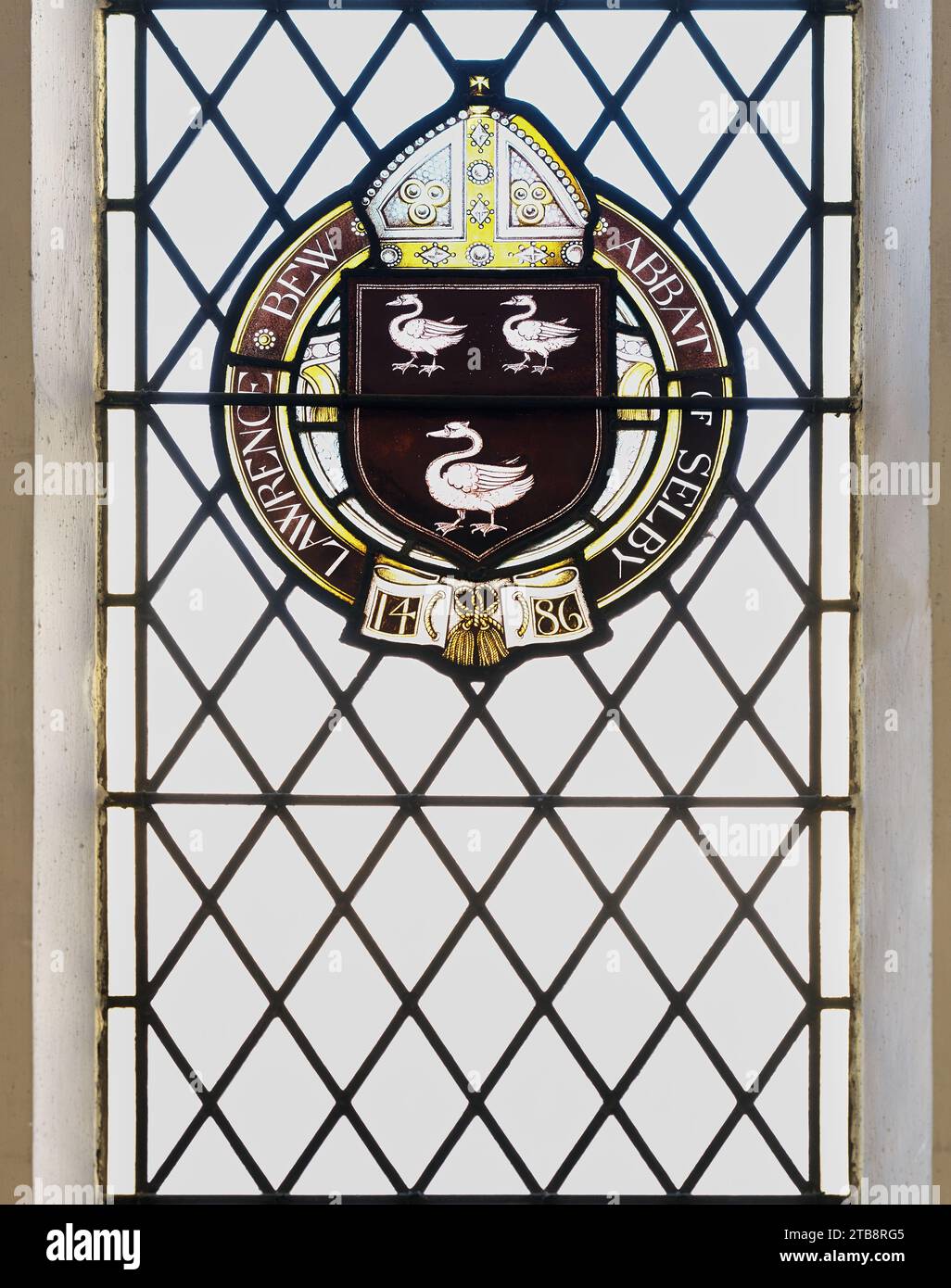A partial stained-glass window, of Lawrence Bew, Abbot of Selby, donor ...