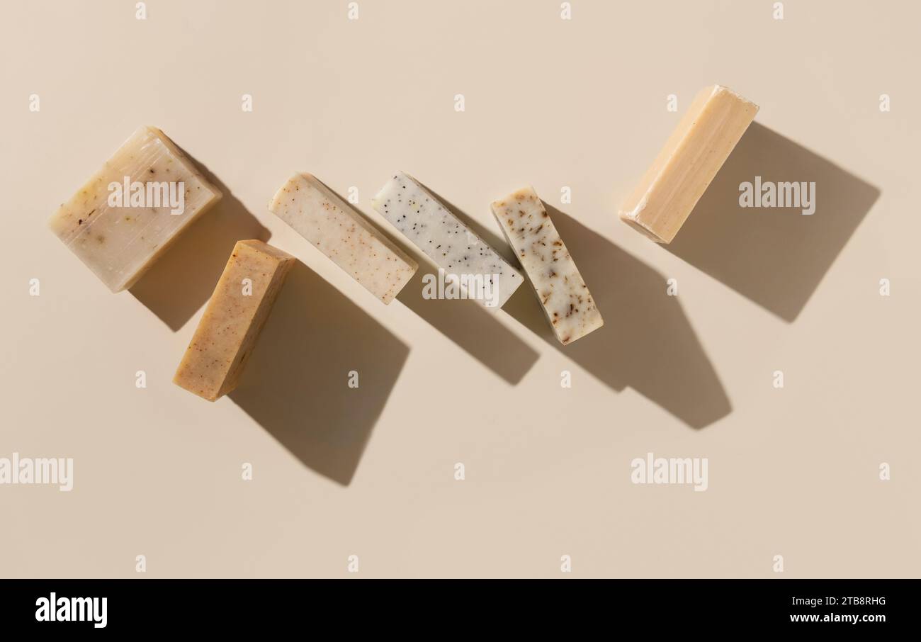 Natural herbal beige and brown handmade soap bars on light beige top ...