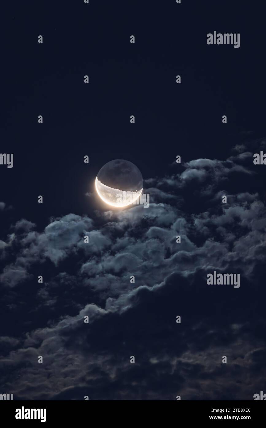 Full moon twilight with craters on the surface and dark sky, close up ...
