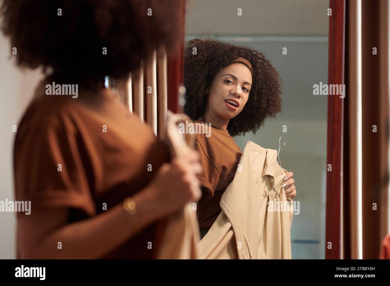 Woman trying new outfit hi-res stock photography and images - Alamy