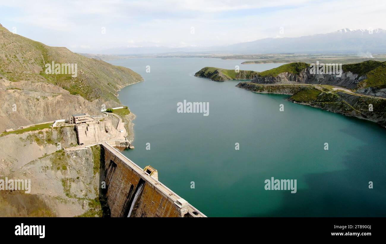 Aerial view of hydroelectric power station. Dam with falling water from ...