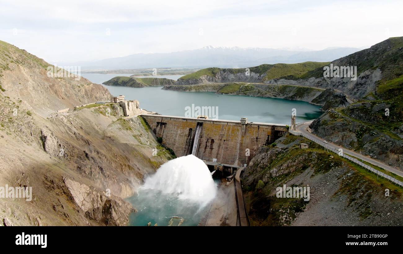 Aerial view of hydroelectric power station. Dam with falling water from ...