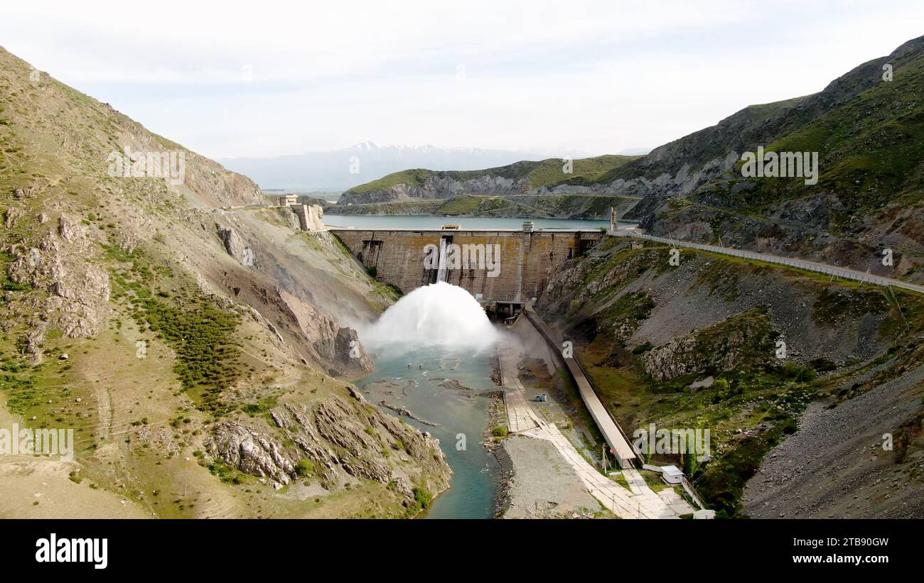 Aerial view of hydroelectric power station. Dam with falling water from ...