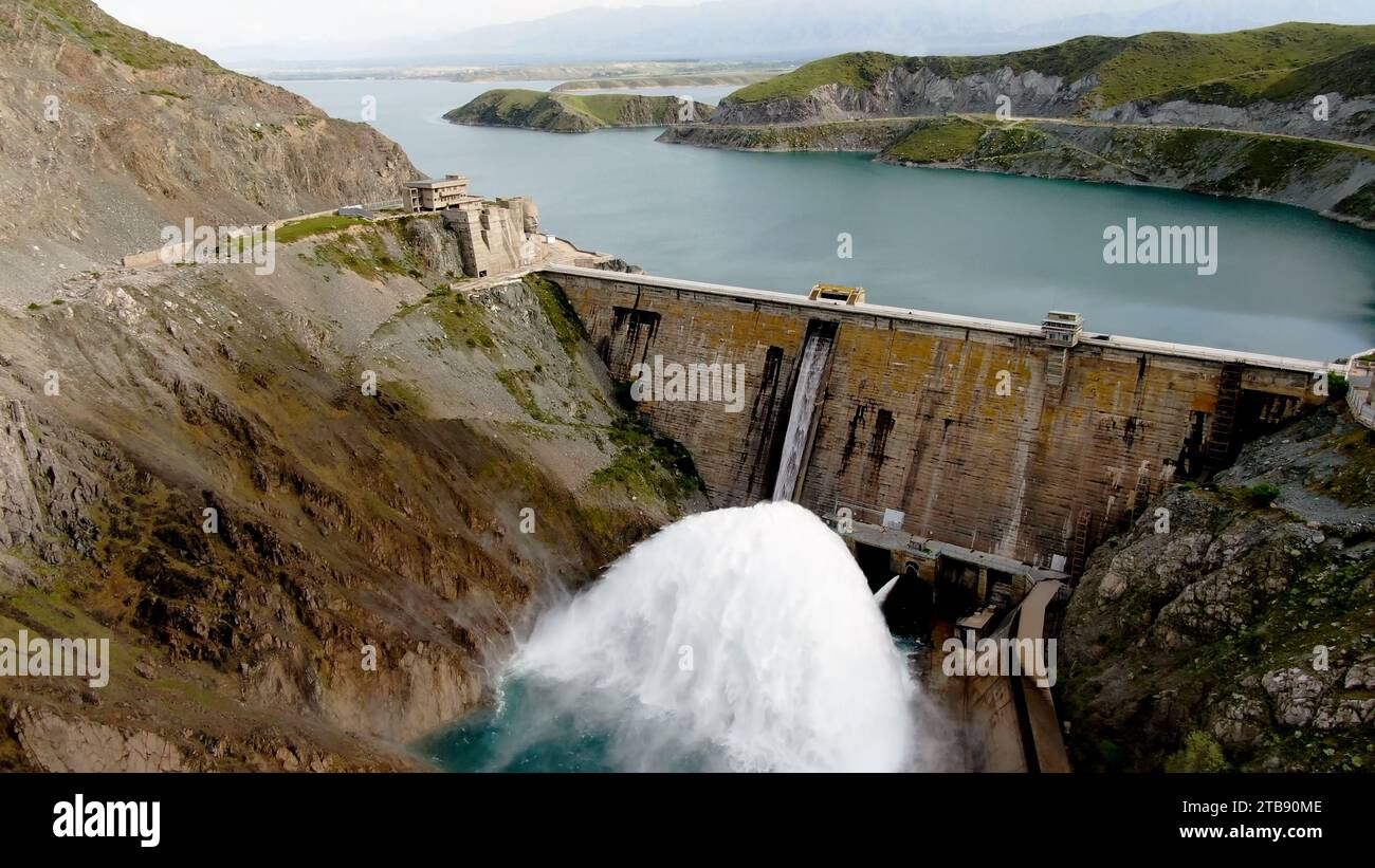 Aerial view of hydroelectric power station. Dam with falling water from ...