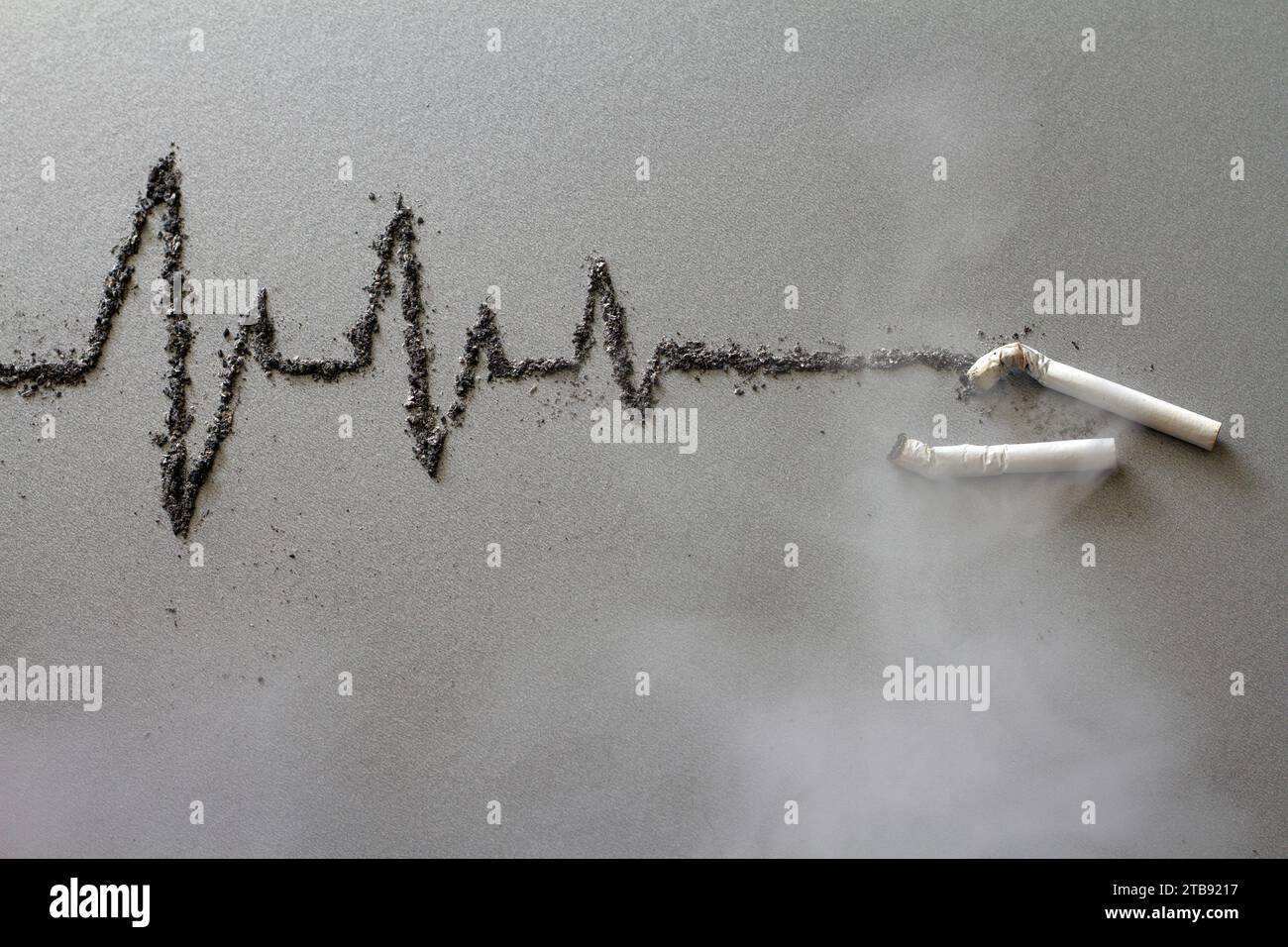 Cigarettes and cardiogram made of ash in fumes of smoke, harmful ...