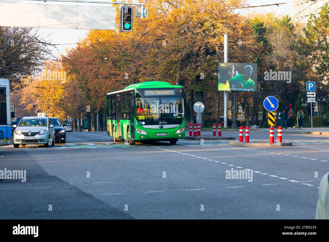 Almaty, Kazakhstan - October 28, 2023: Green bus in Almaty city street ...