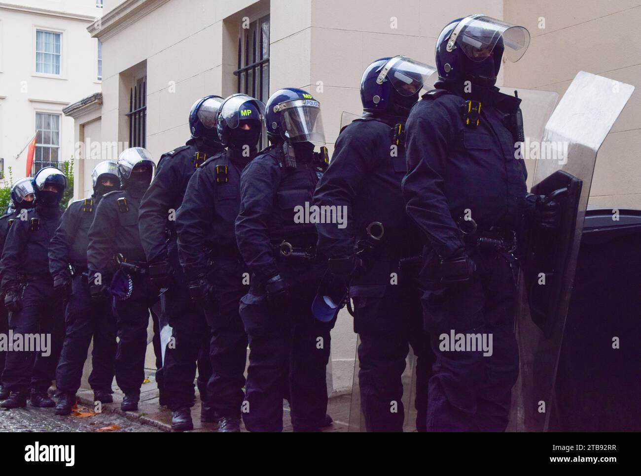 London, UK. 5th December 2023. Police in full riot gear arrive to ...