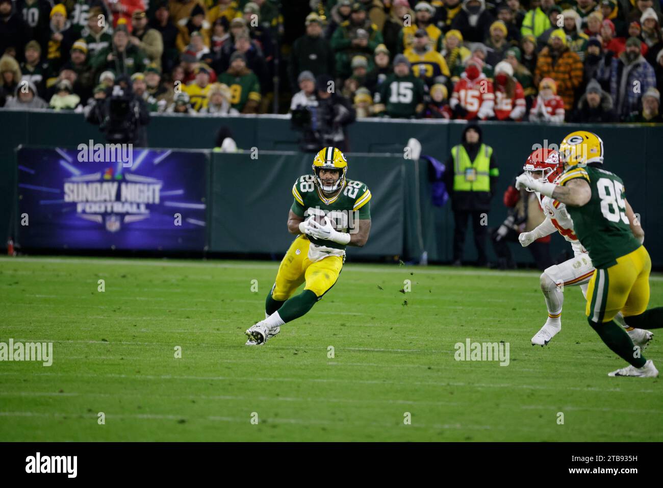 Green Bay Packers running back AJ Dillon (28) tries to elude Kansas ...