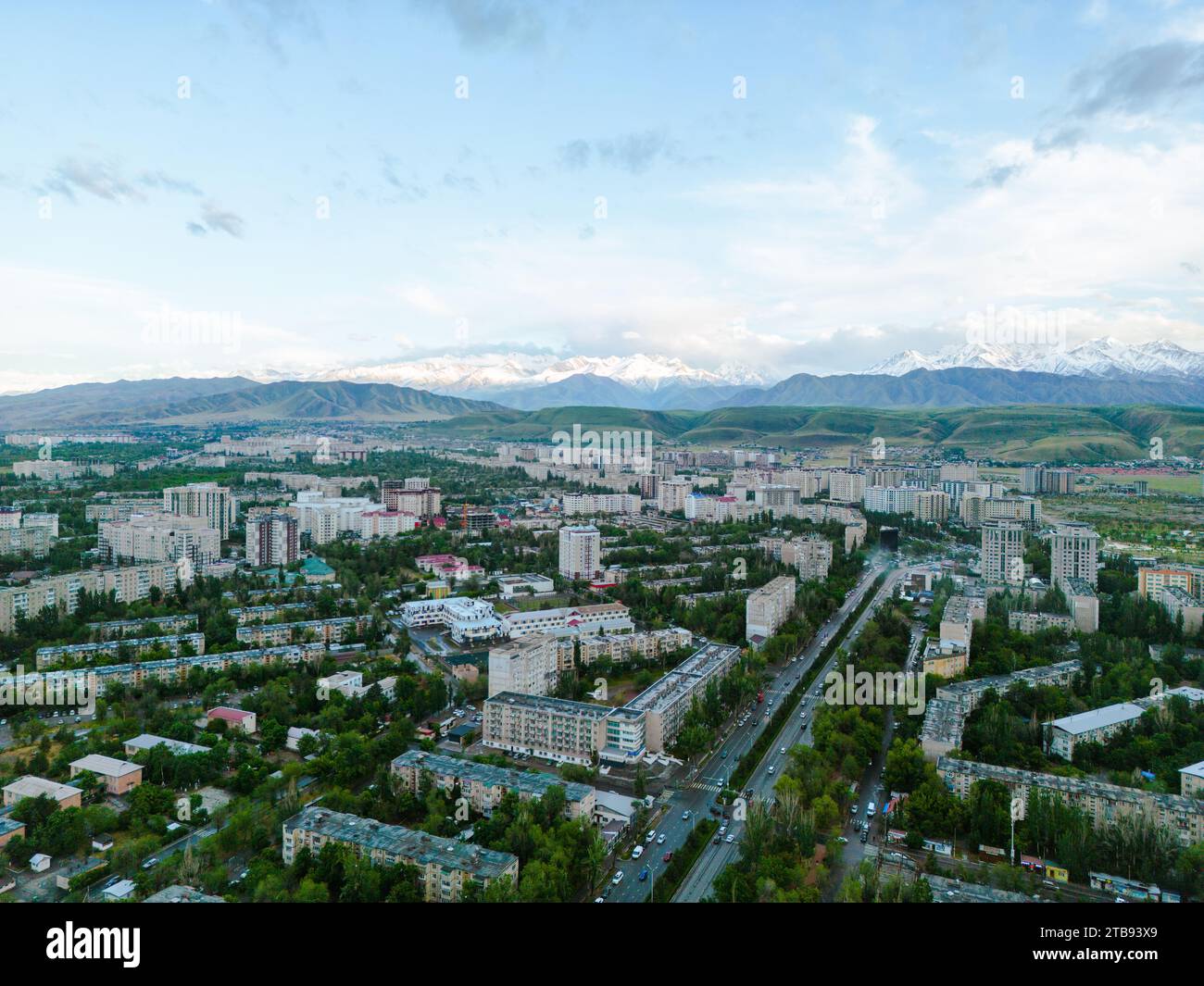 Aerial view of Bishkek city Kyrgyzstan with snowy mountains in the ...