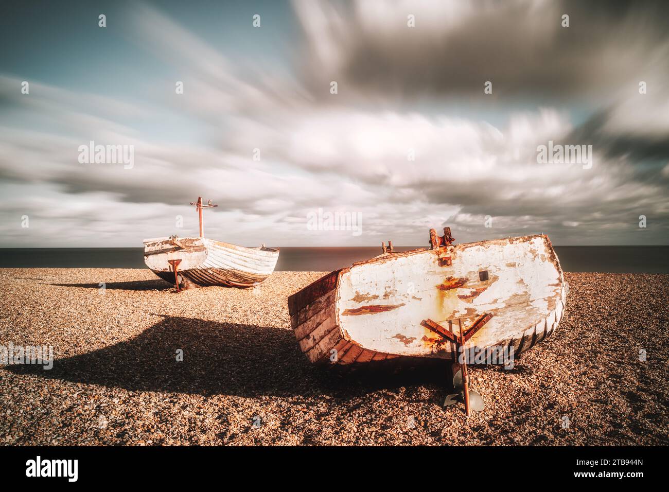 Two fishing boats on a pebble beach Stock Photo - Alamy