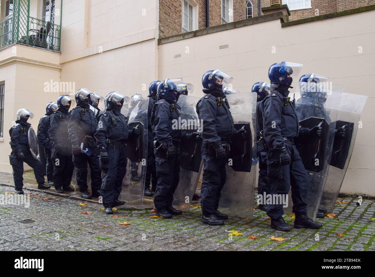 London, UK. 5th December 2023. Police in full riot gear arrive to ...