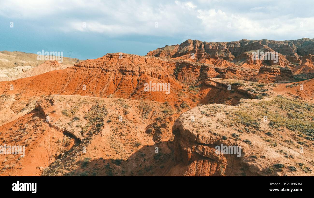 Aerial view of Mars Canyon with red mountain rock in Issyk-Kul region ...