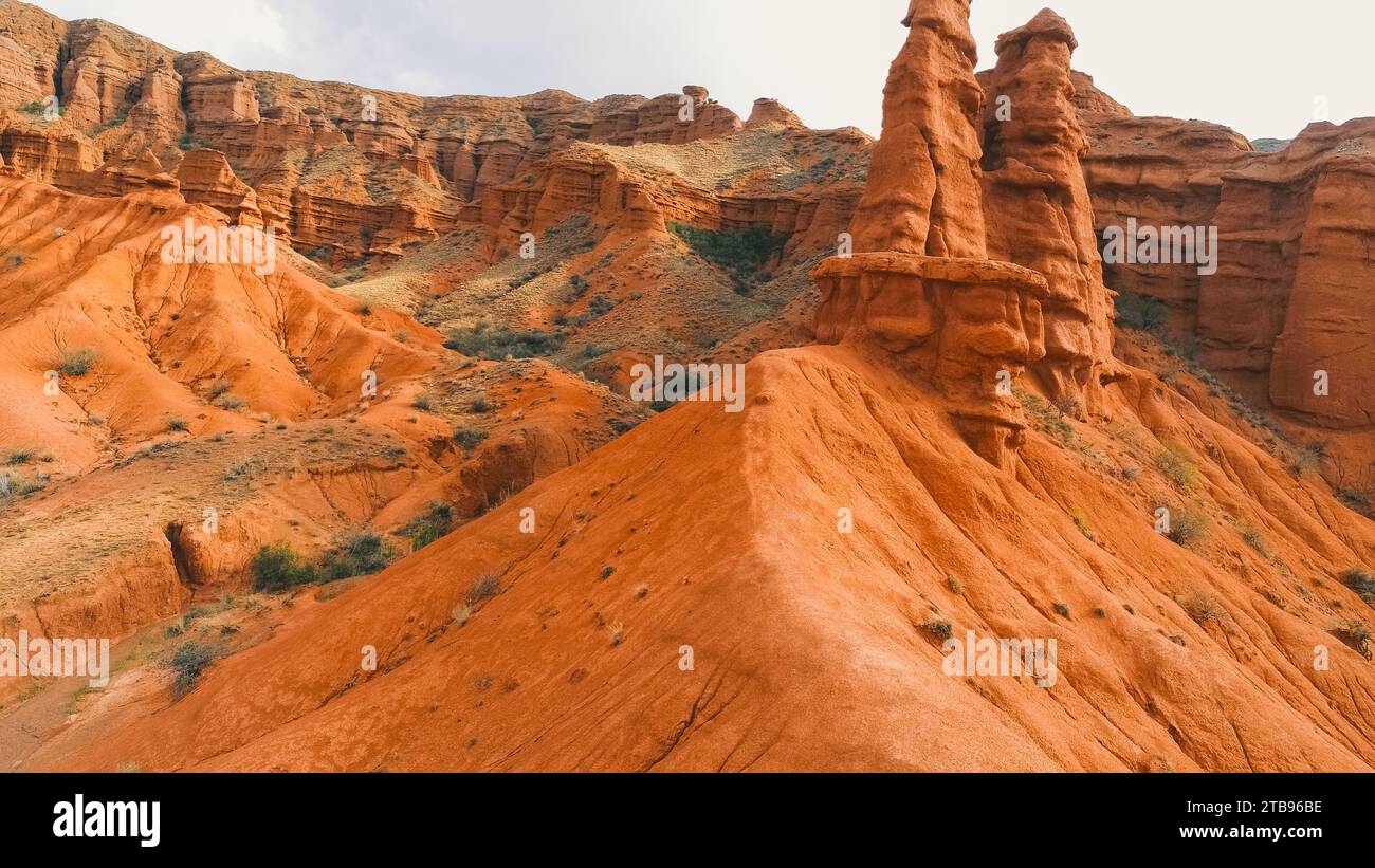 Aerial view of Mars Canyon with red mountain rock in Issyk-Kul region ...
