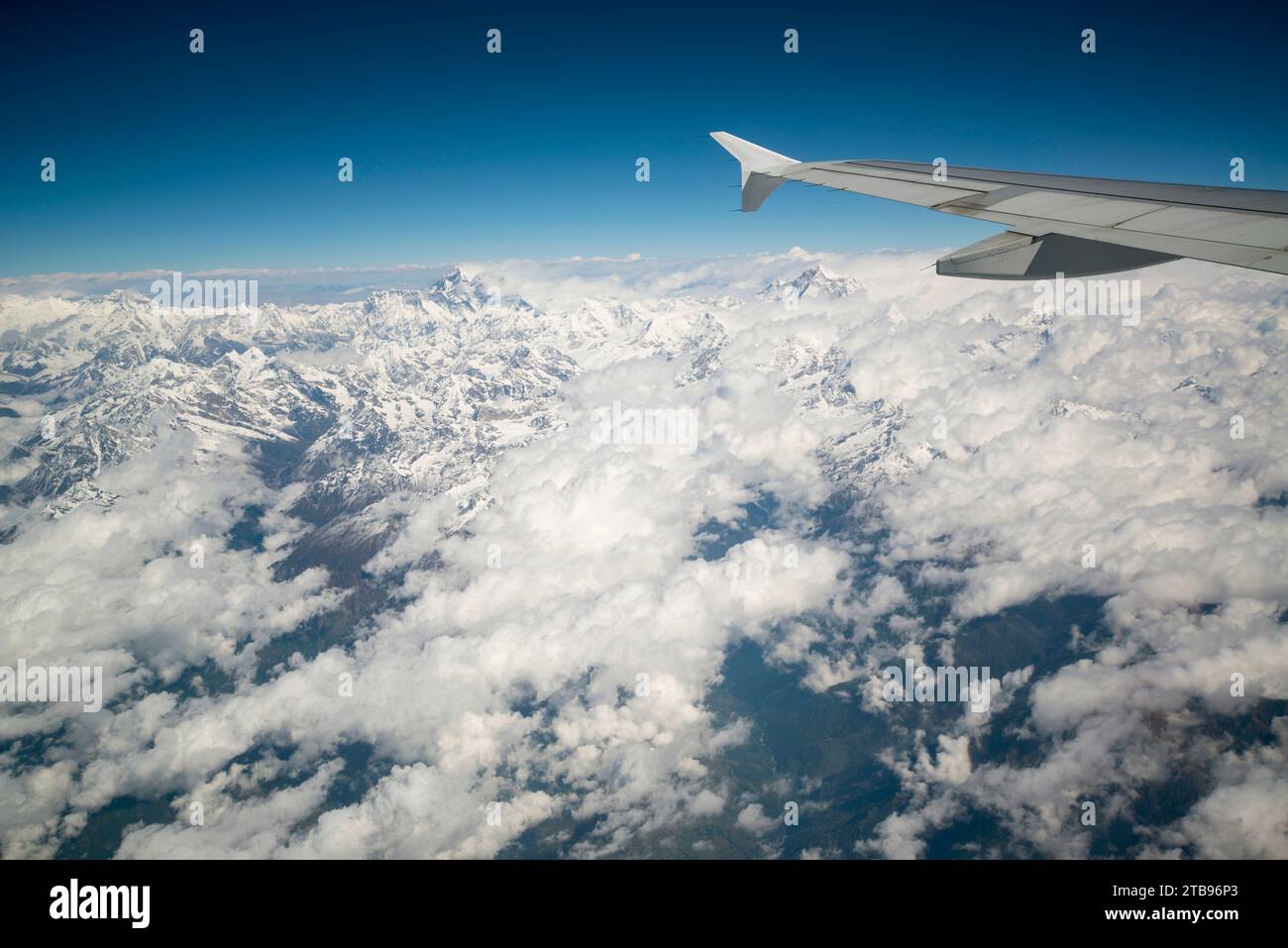 Mount Everest viewed from the window of a jet in the Himalayas; Nepal ...