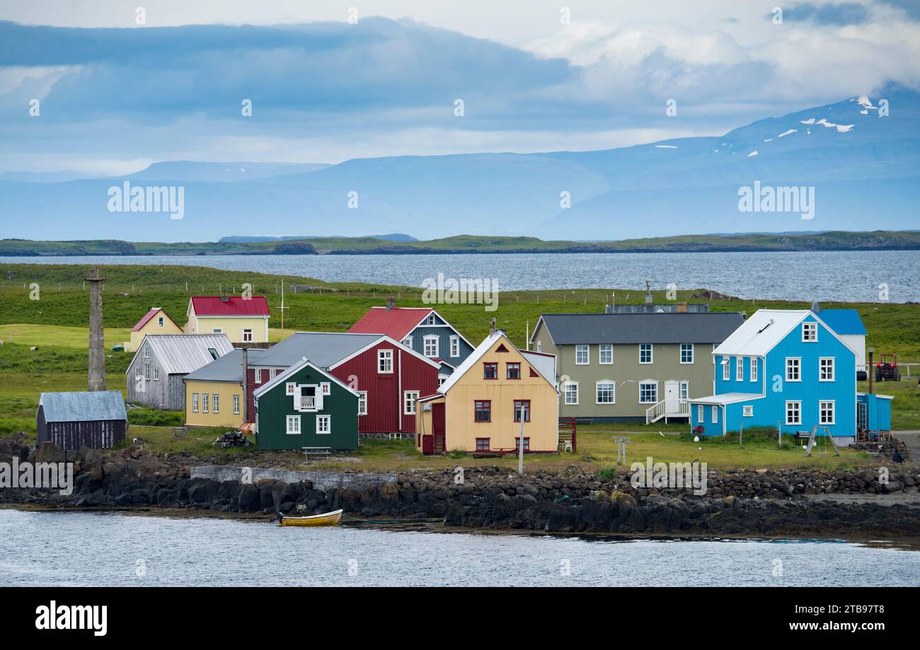 Colourful houses Flatey Island with mountains and water in the ...