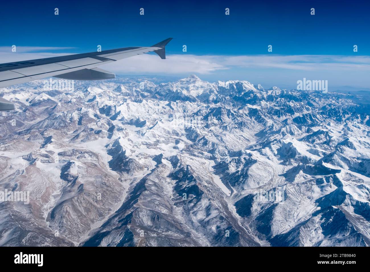 Jet in flight above the mountains of the high Tibet plateau; Lhasa ...