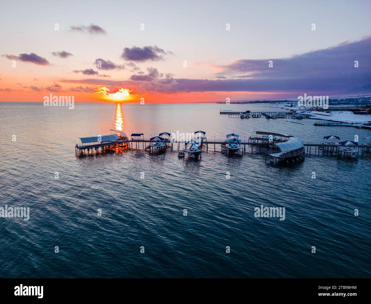 Aerial view of amazing colorful sunset over the ocean with huge cloud ...