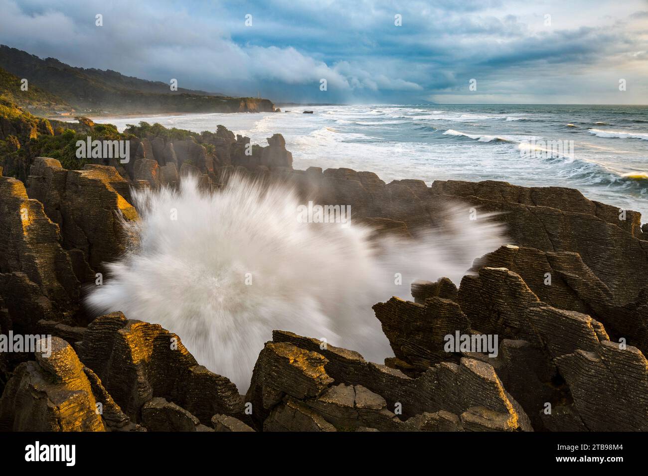 Splashes at Punakaiki, or Pancake rocks, at high tide on the South ...