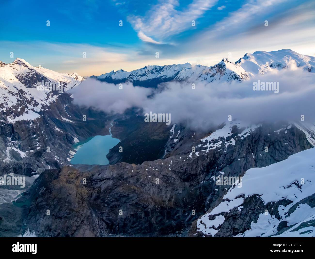 Southern Alps seen from a helicopter at sunrise Stock Photo - Alamy