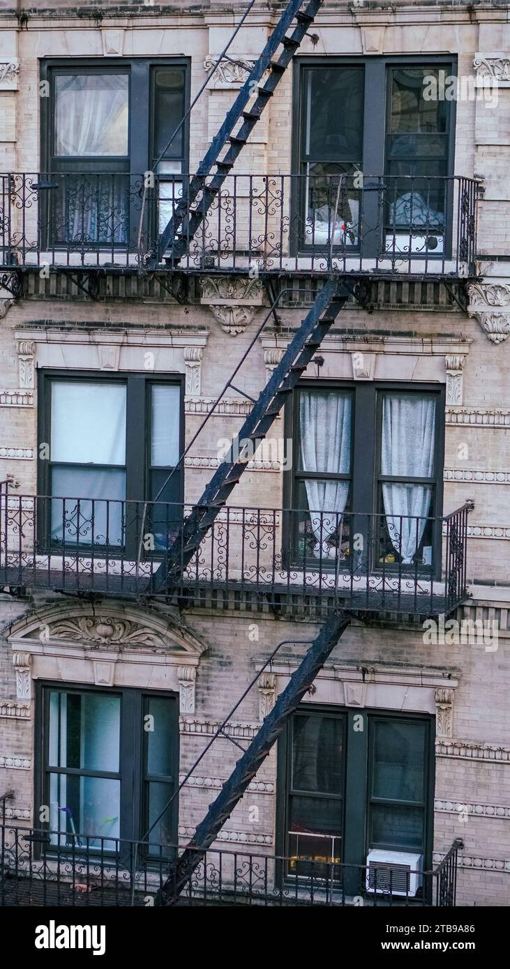 Typical New York fire escape ladders and balconies Stock Photo - Alamy