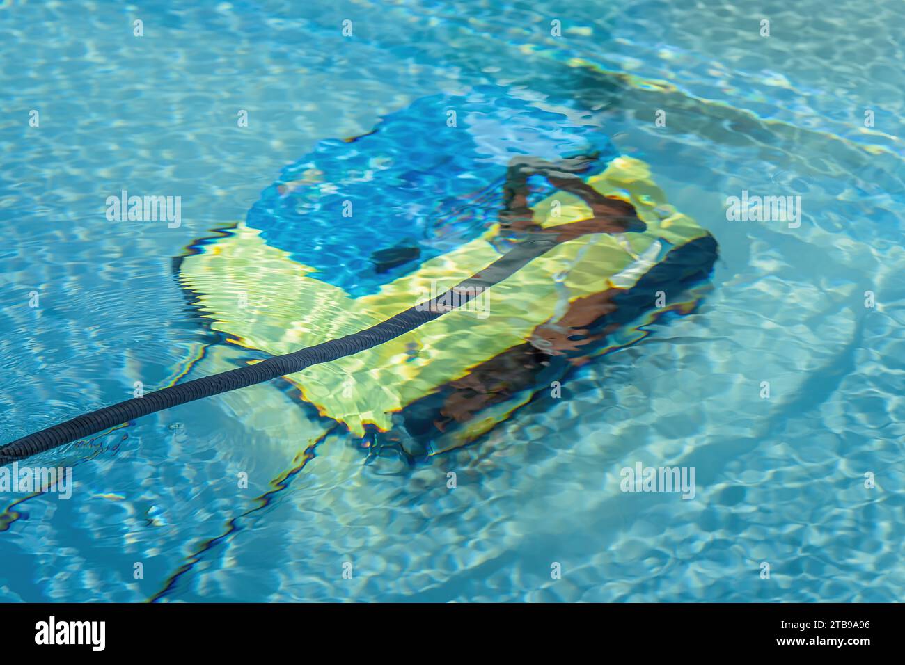 Cleaning the pool floor with an underwater vacuum cleaner, pool ...