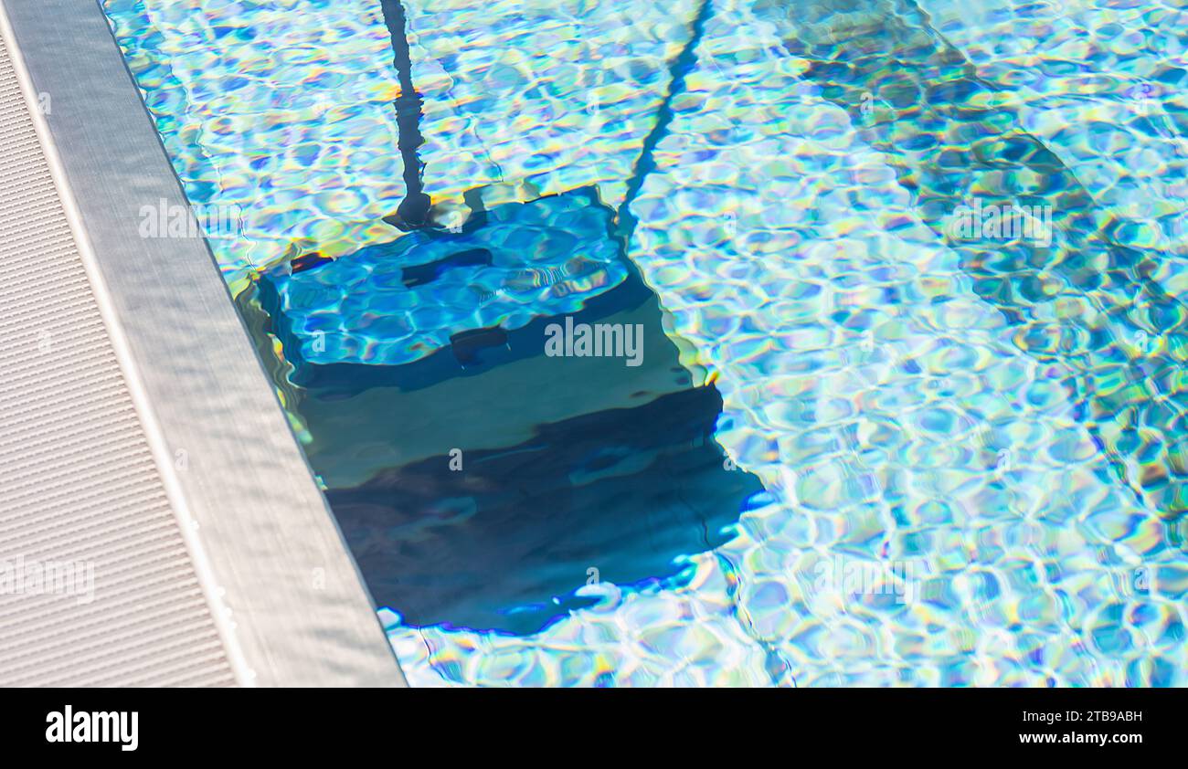 Reflection of a cleaning robot in a pool, with a distorted underwater ...