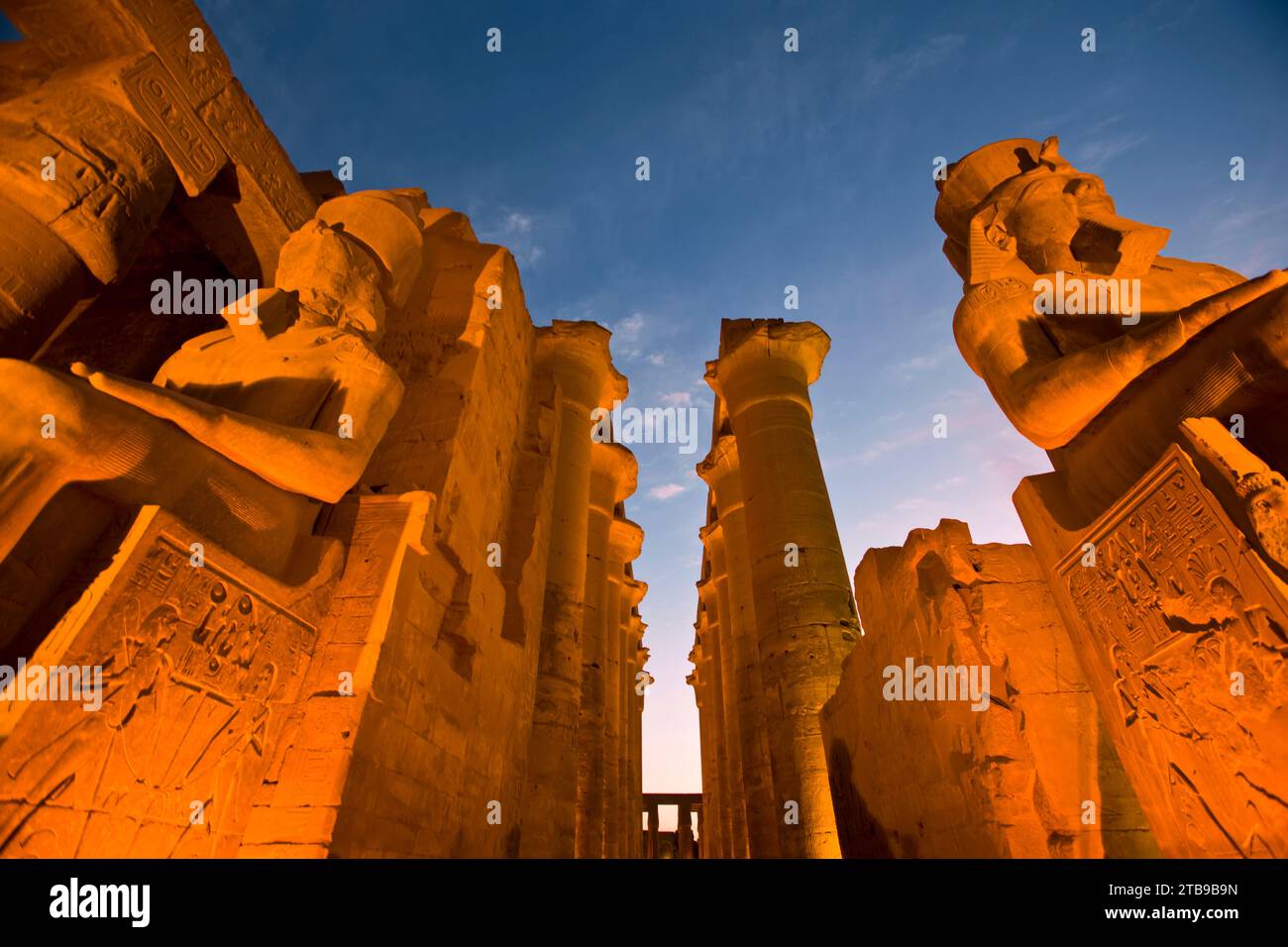 Ramses II Colossus at the entrance and central corridor of Luxor temple ...