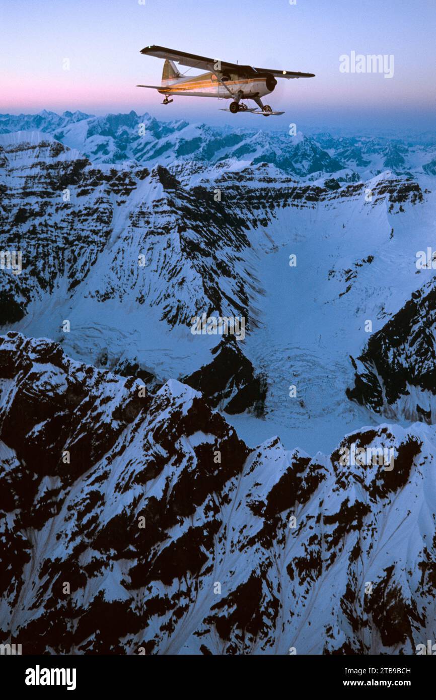 Ski plane flies over Mount Denali in Denali National Park and Preserve ...