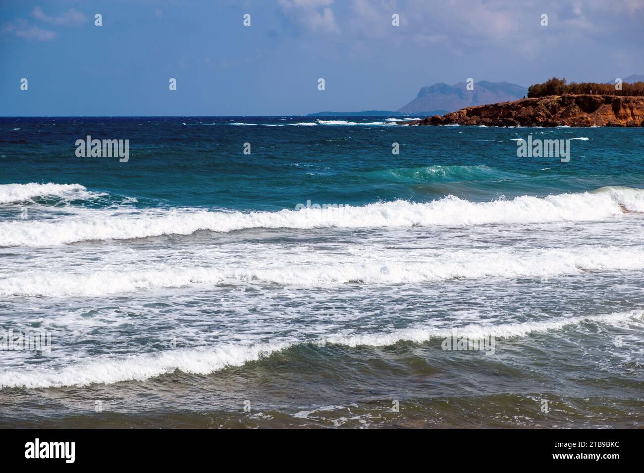 Greece ripple dark sea water, splashing white foam, part of rocky Greek ...