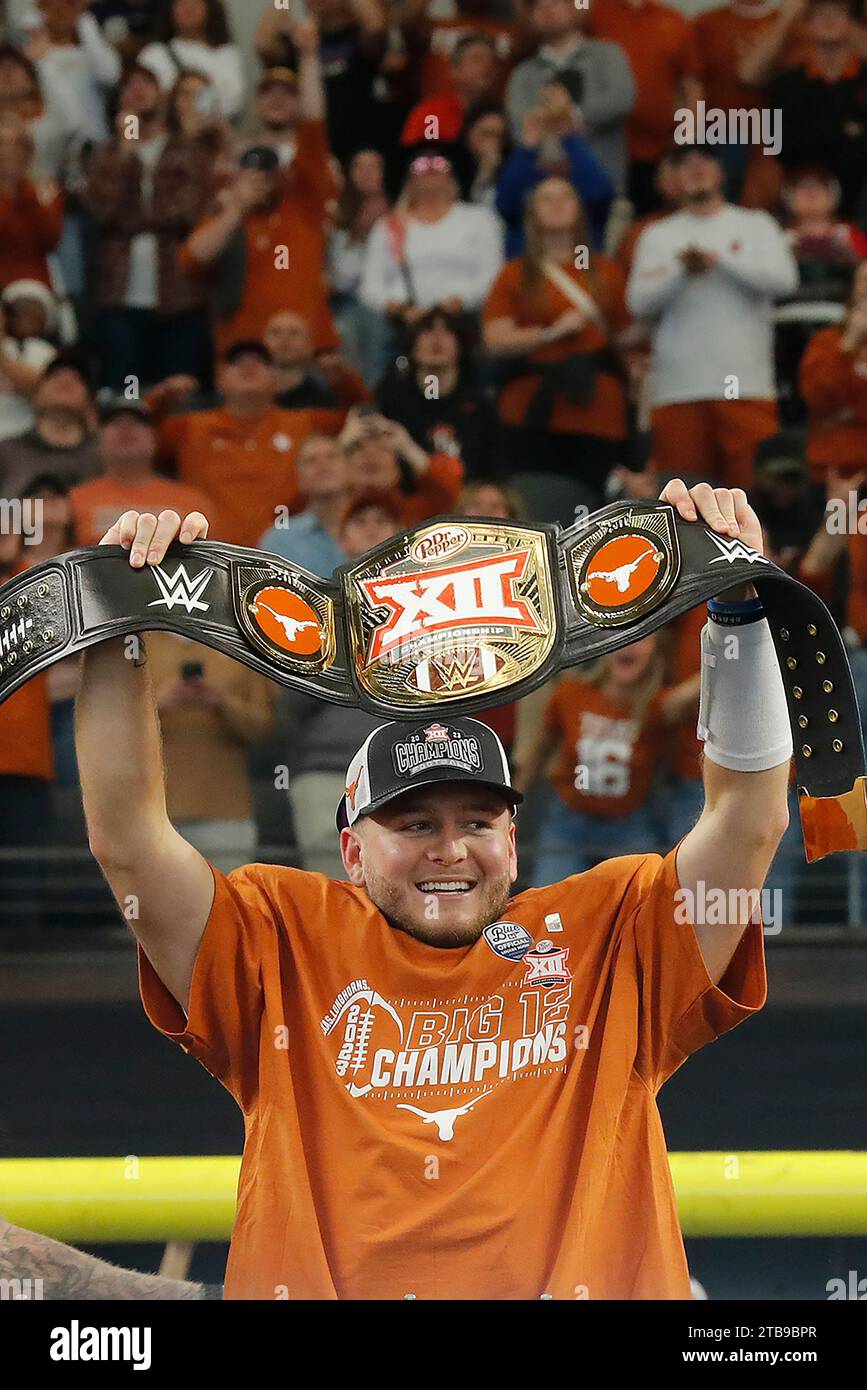 Texas quarterback Quinn Ewers holds up his WWE Big 12 MVP Championship Belt after an NCAA ...