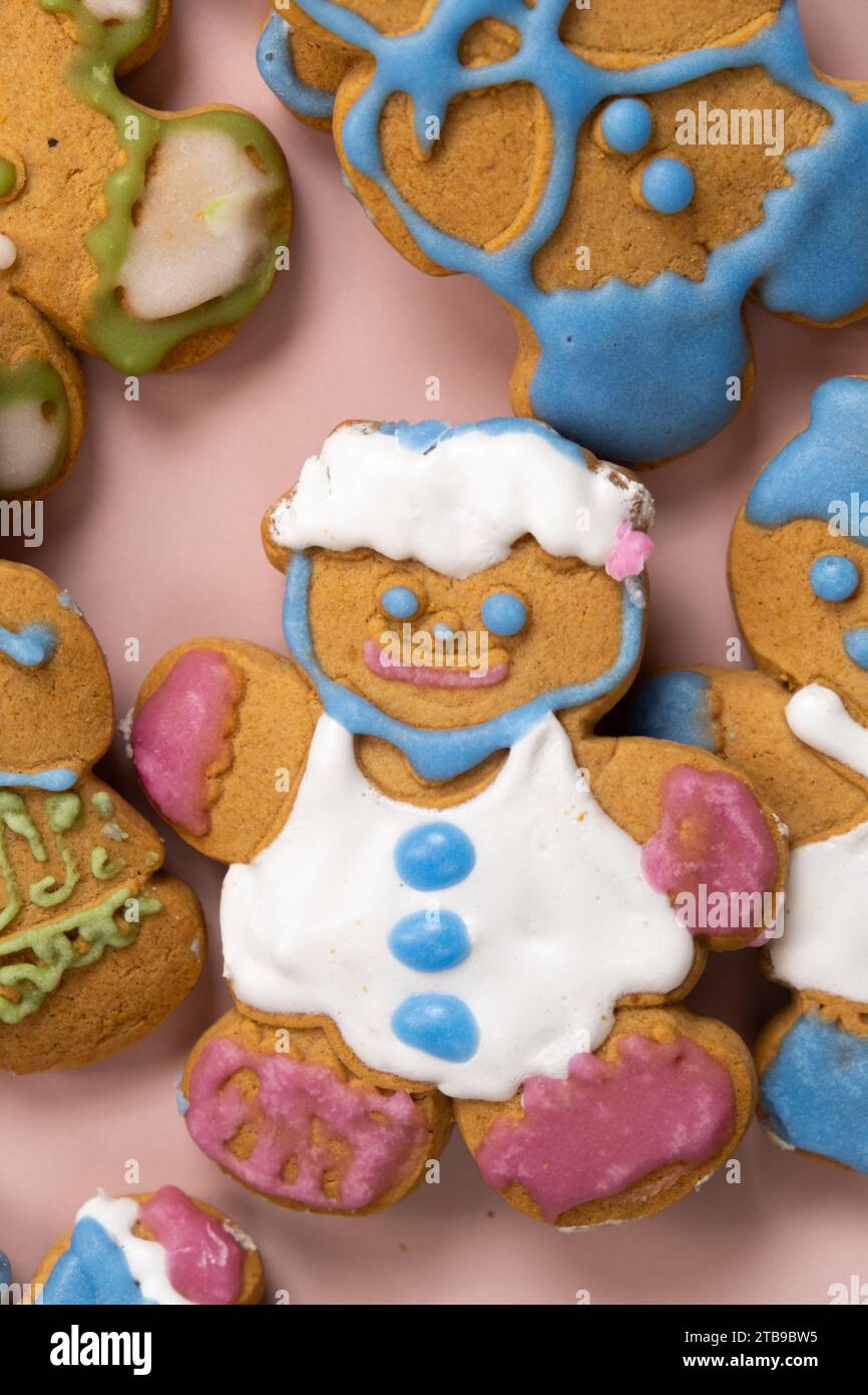 Christmas gingerbread in the shape of men decorated with colorful icing ...