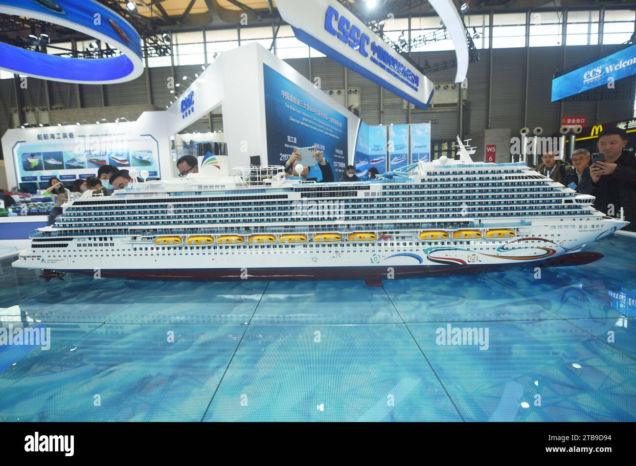 Shanghai, China. 05th Dec, 2023. Visitors are looking at the model of ...