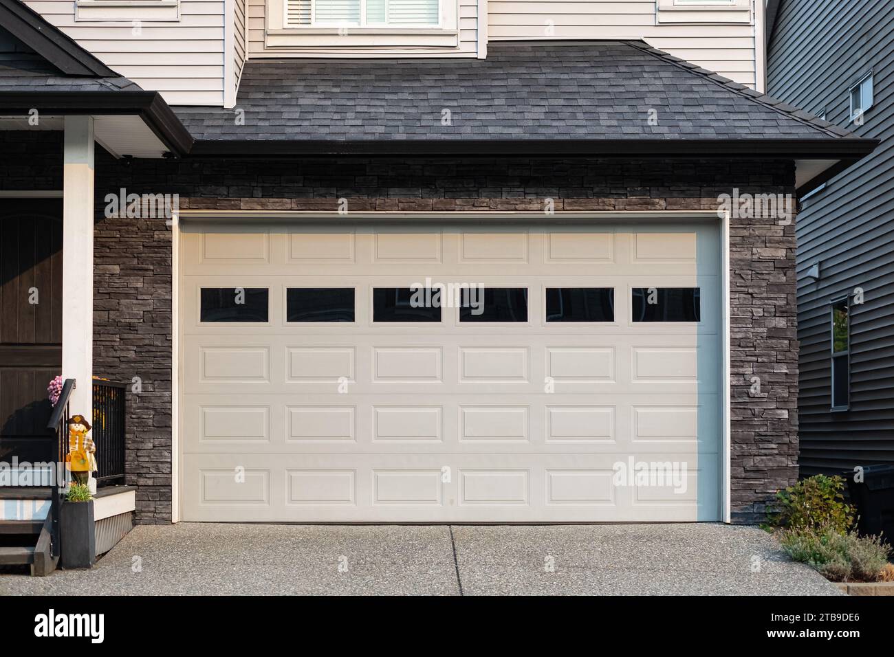 Garage Door. Modern house with garage door that is closed. A perfect ...