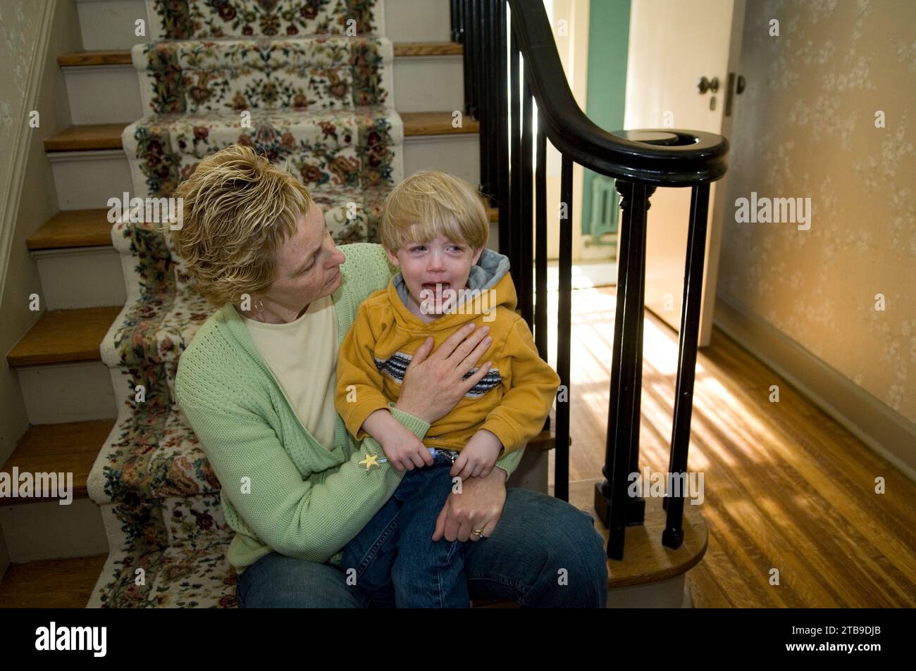 Mother soothing her young son who is crying; Lincoln, Nebraska, United ...