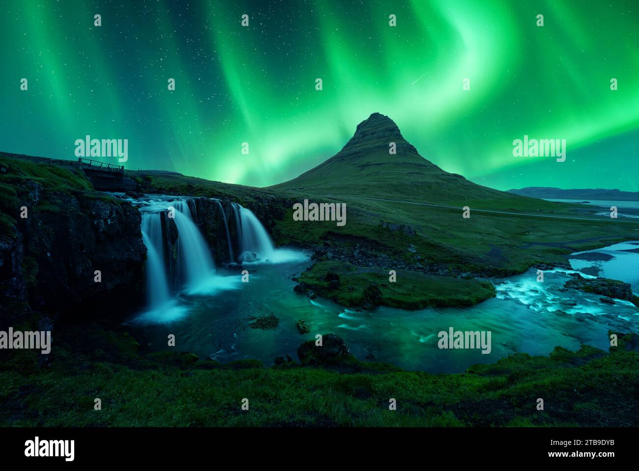 Northern lights over Kirkjufell mountain and Kirkjufellsfoss waterfall ...