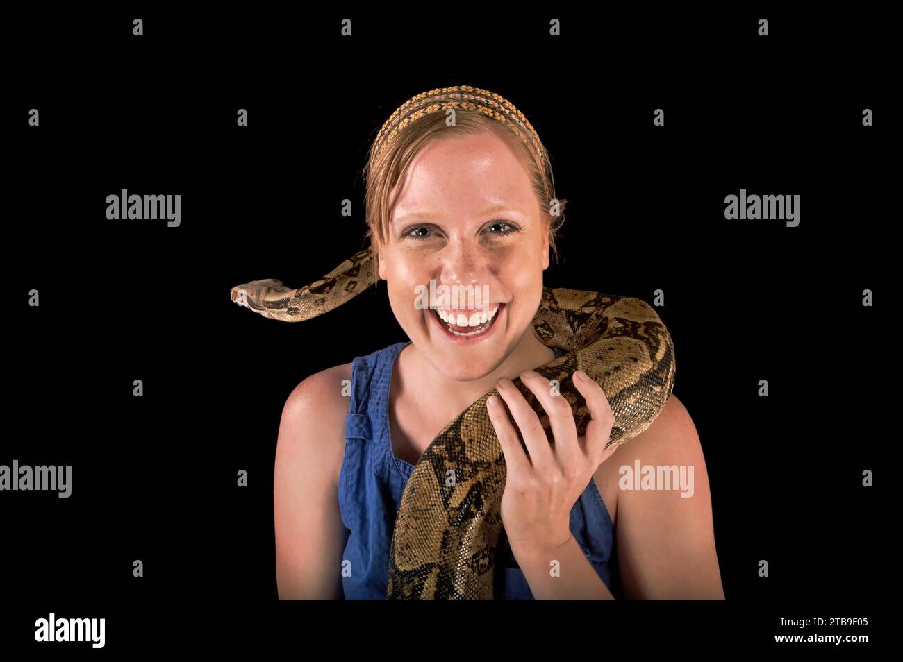 Woman holding snake hi-res stock photography and images - Alamy