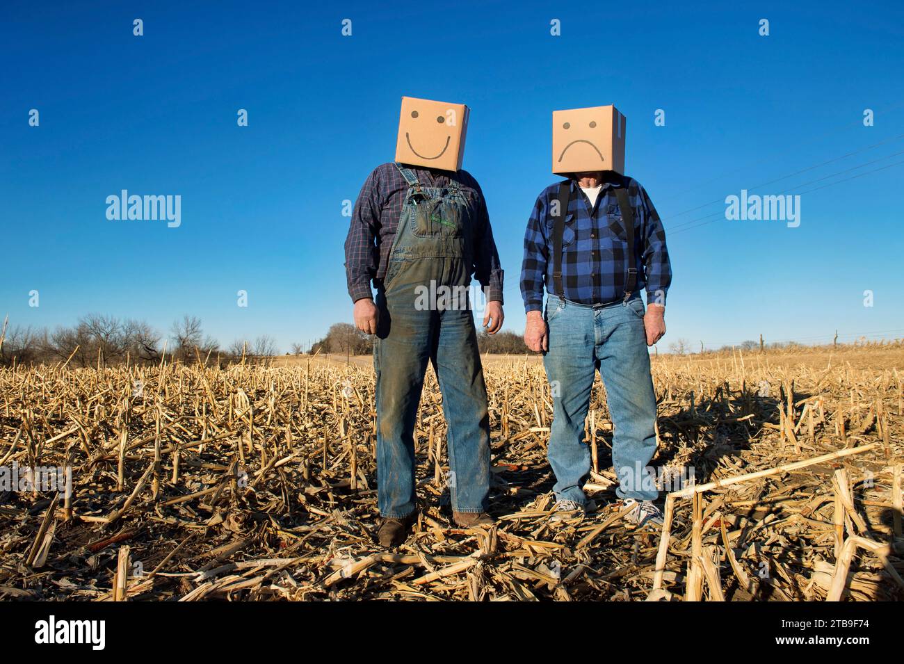 Two farmers wear a happy and an unhappy box head; Lincoln, Nebraska ...