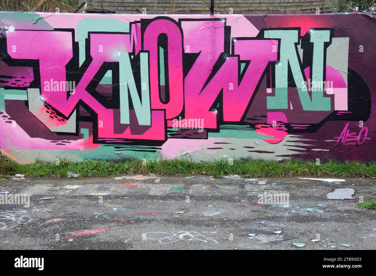 Urban street art. Colourful graphic graffiti letters spell KNOWN ...