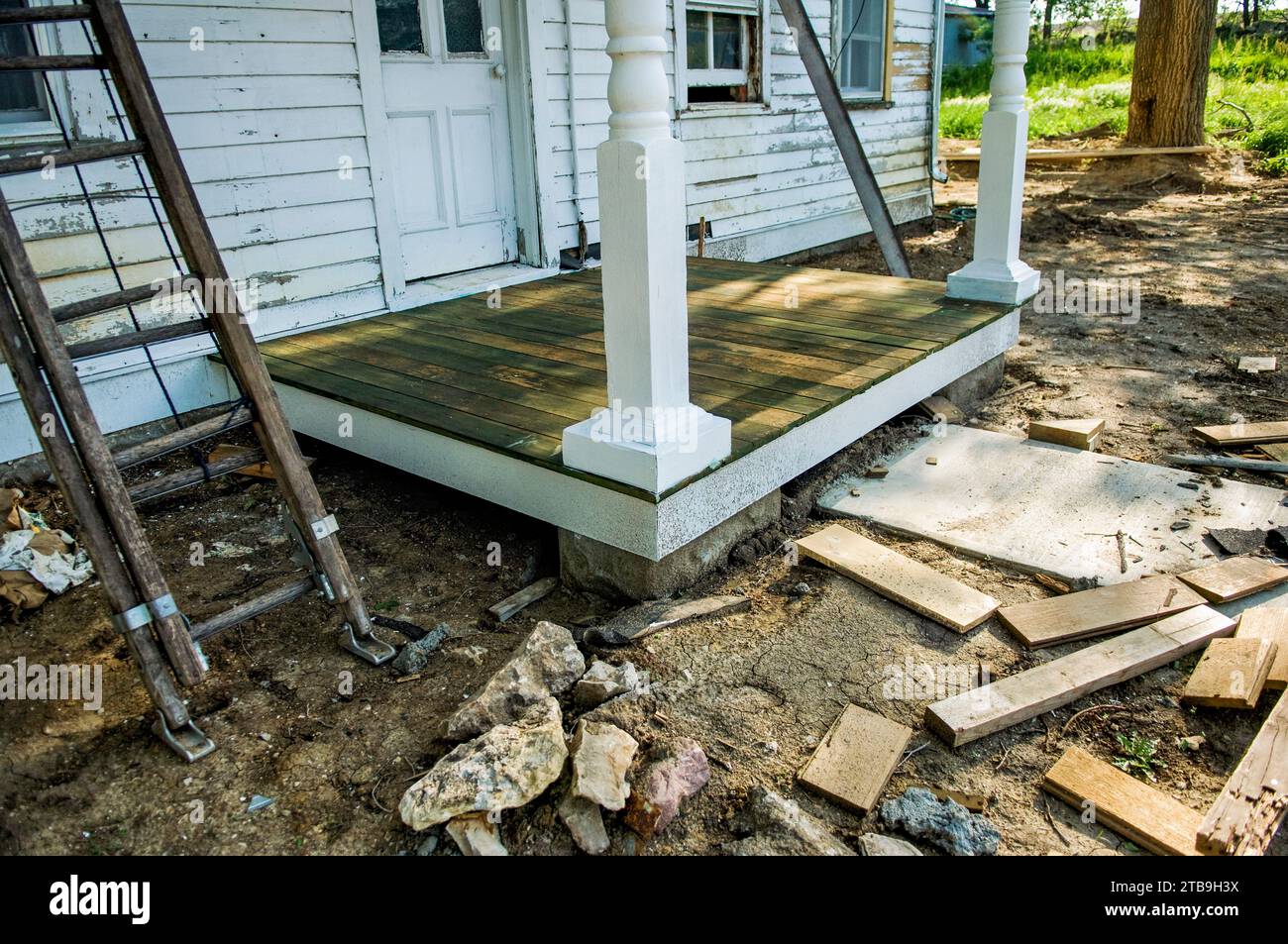 Old house being remodelled, with scraps of building materials outside ...