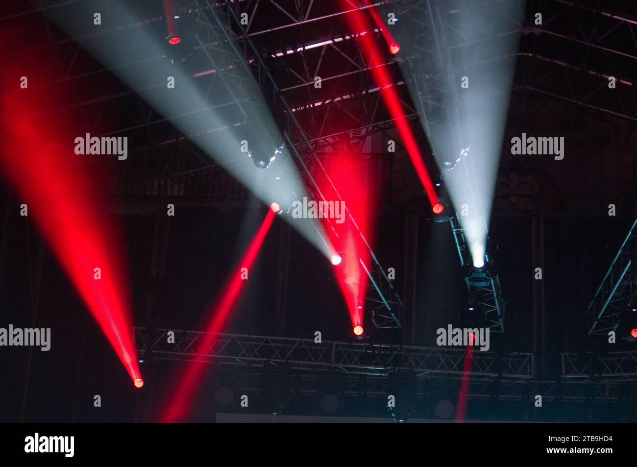 Stage lights during a concert. Light cannons project colored beams of ...