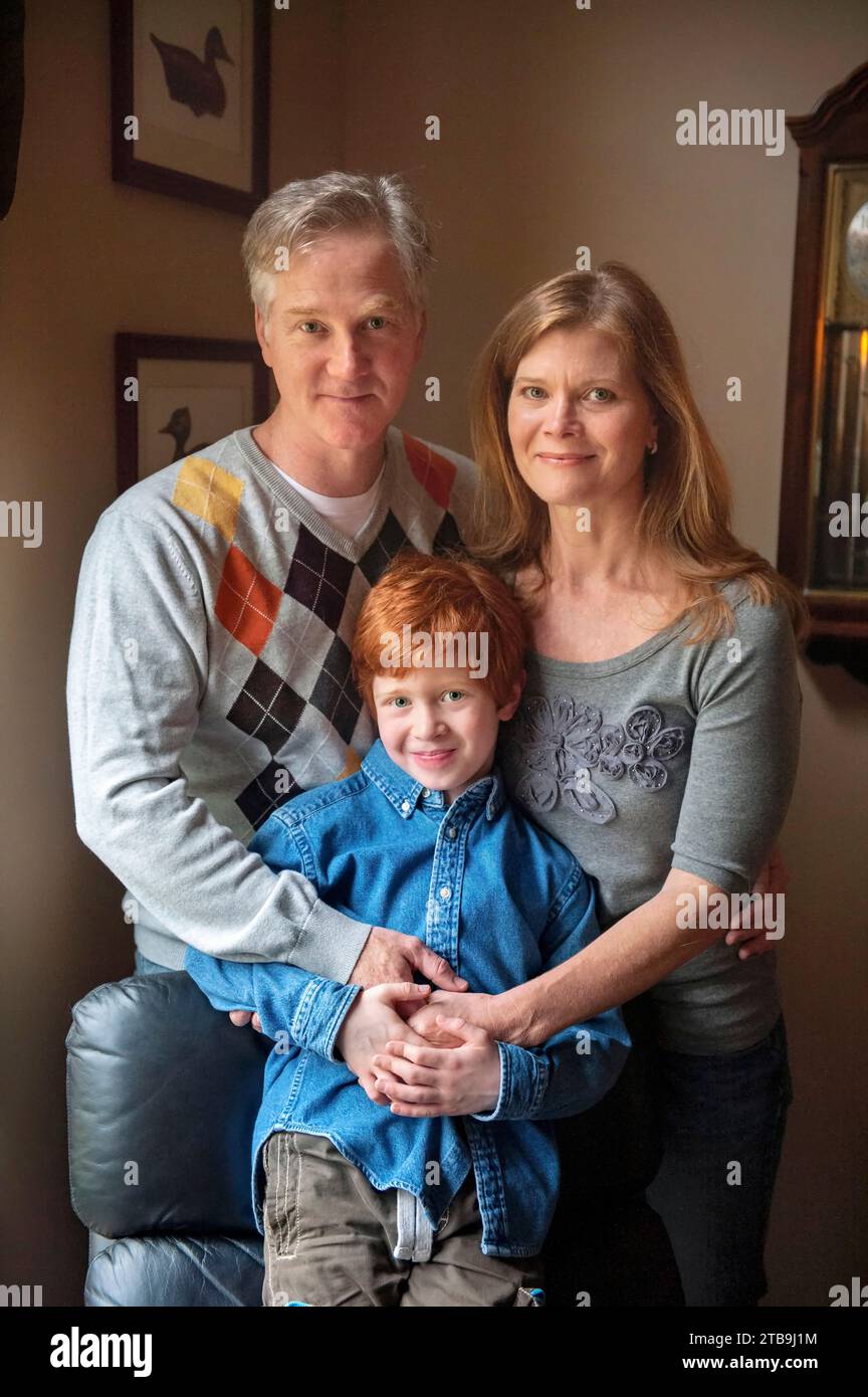 Family poses for a portrait in their home; Atlanta, Georgia, United ...